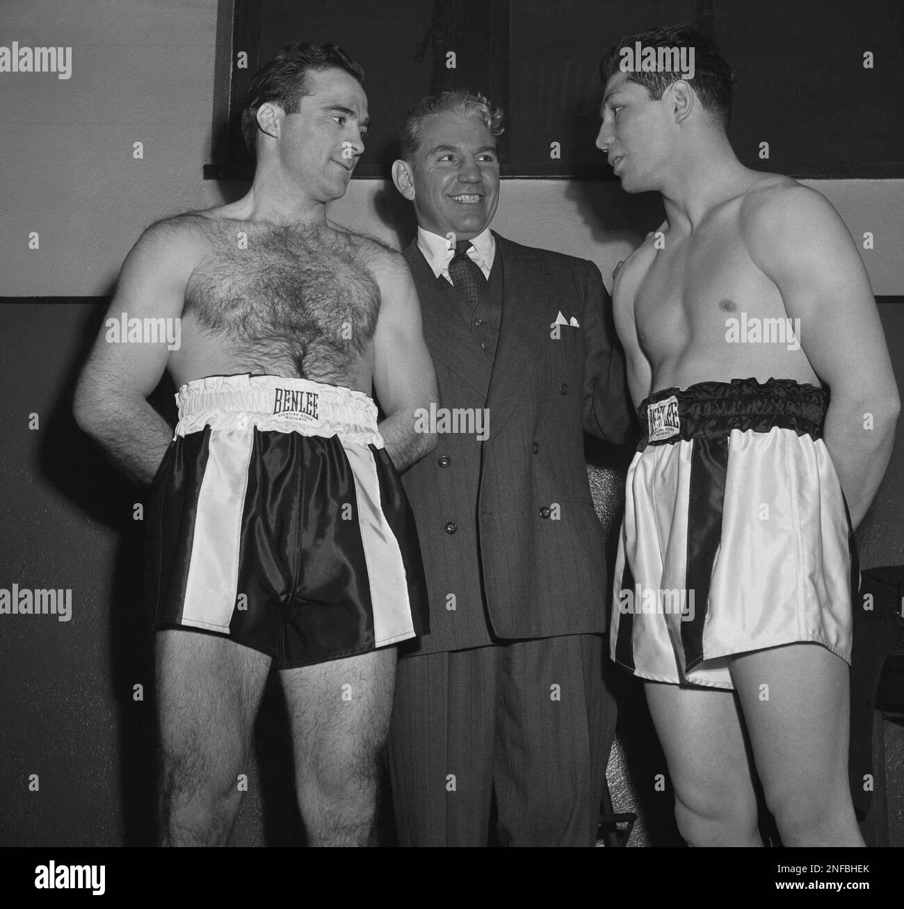 Marcel Cerdan, left, with Eddie Eagan, boxing commissioner, center, and ...