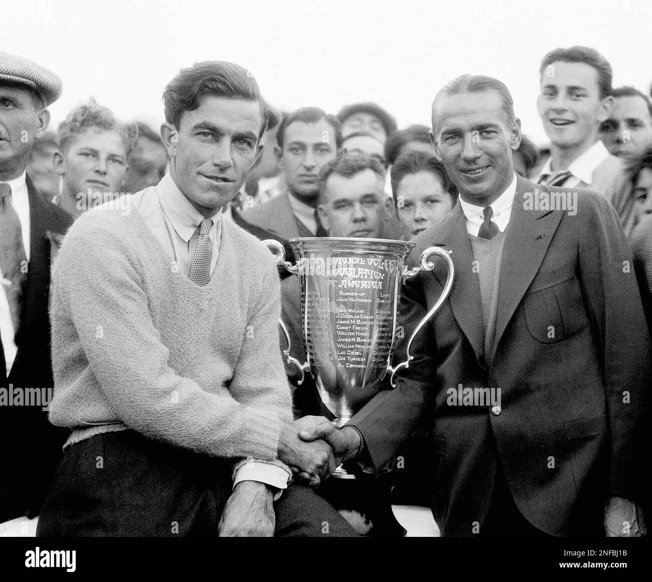Johnny Farrell, left, shakes hands with PGA winner Leo Diegel as they ...