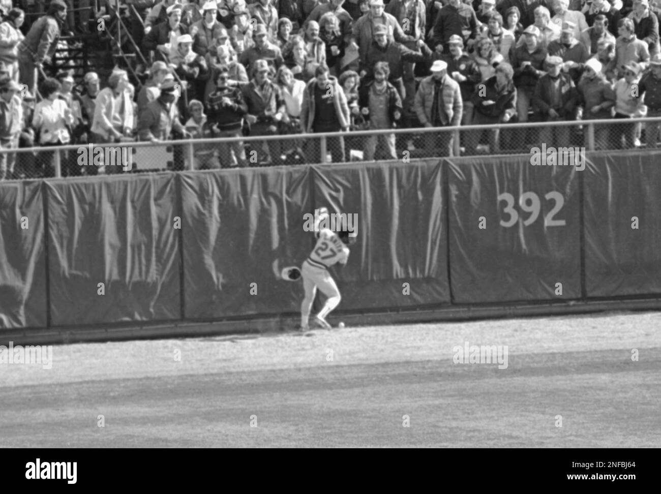 St. Louis Cardinals left fielder Lonnie Smith bounces off the wall as a ...