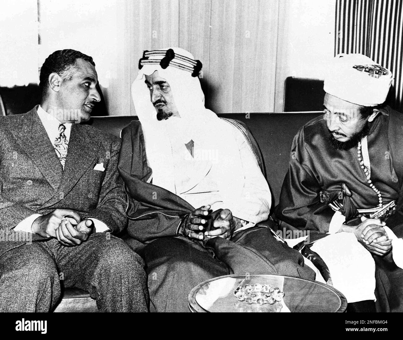 Egyptian Premier Gamal Abdel Nasser, left, talks with Saudi Arabia's Premier Prince Feisal ...