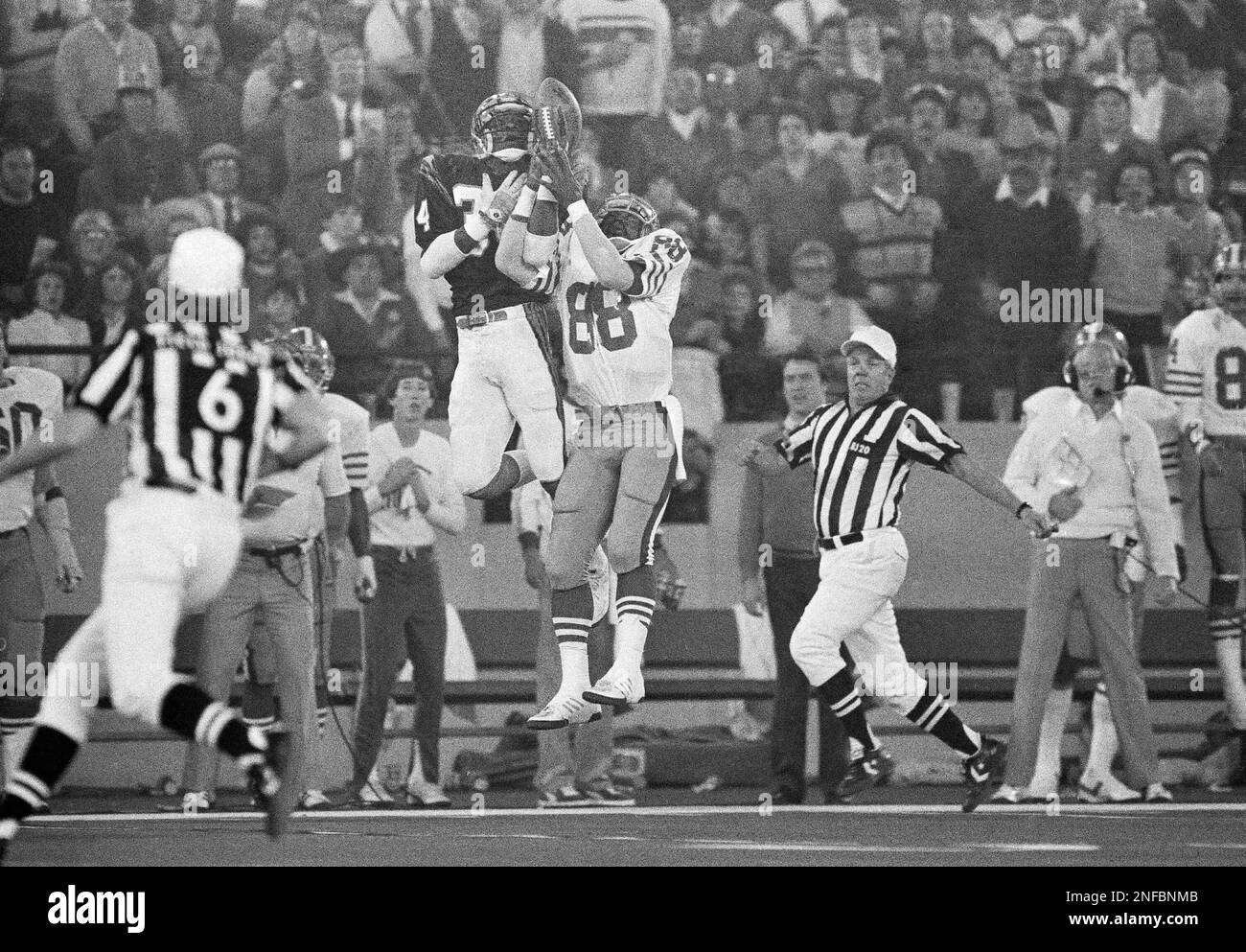 Cincinnati Bengals cornerback Louis Breeden, left, manages to break up ...