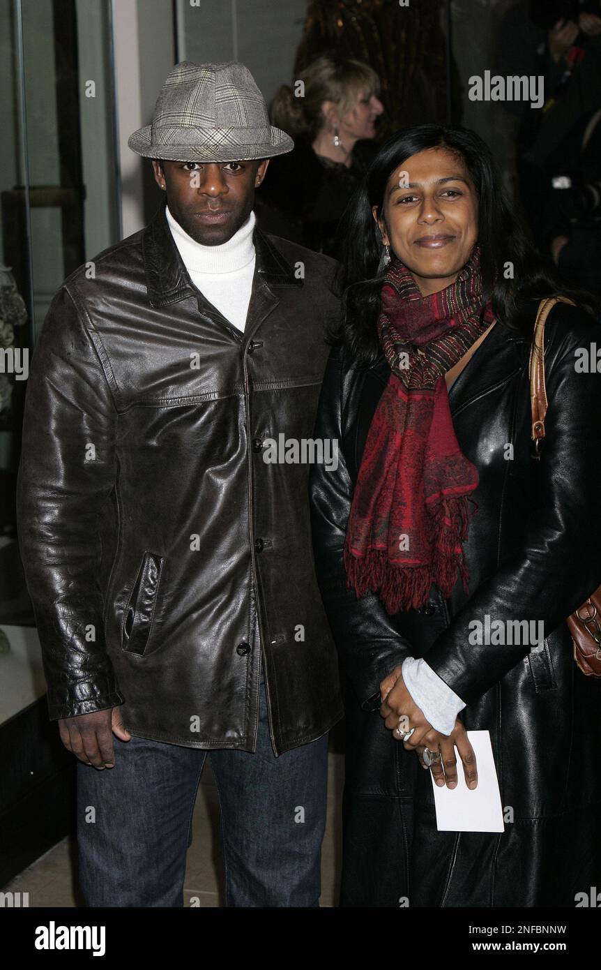 British actor Adrian Lester, left, arrives with his guest for the ...