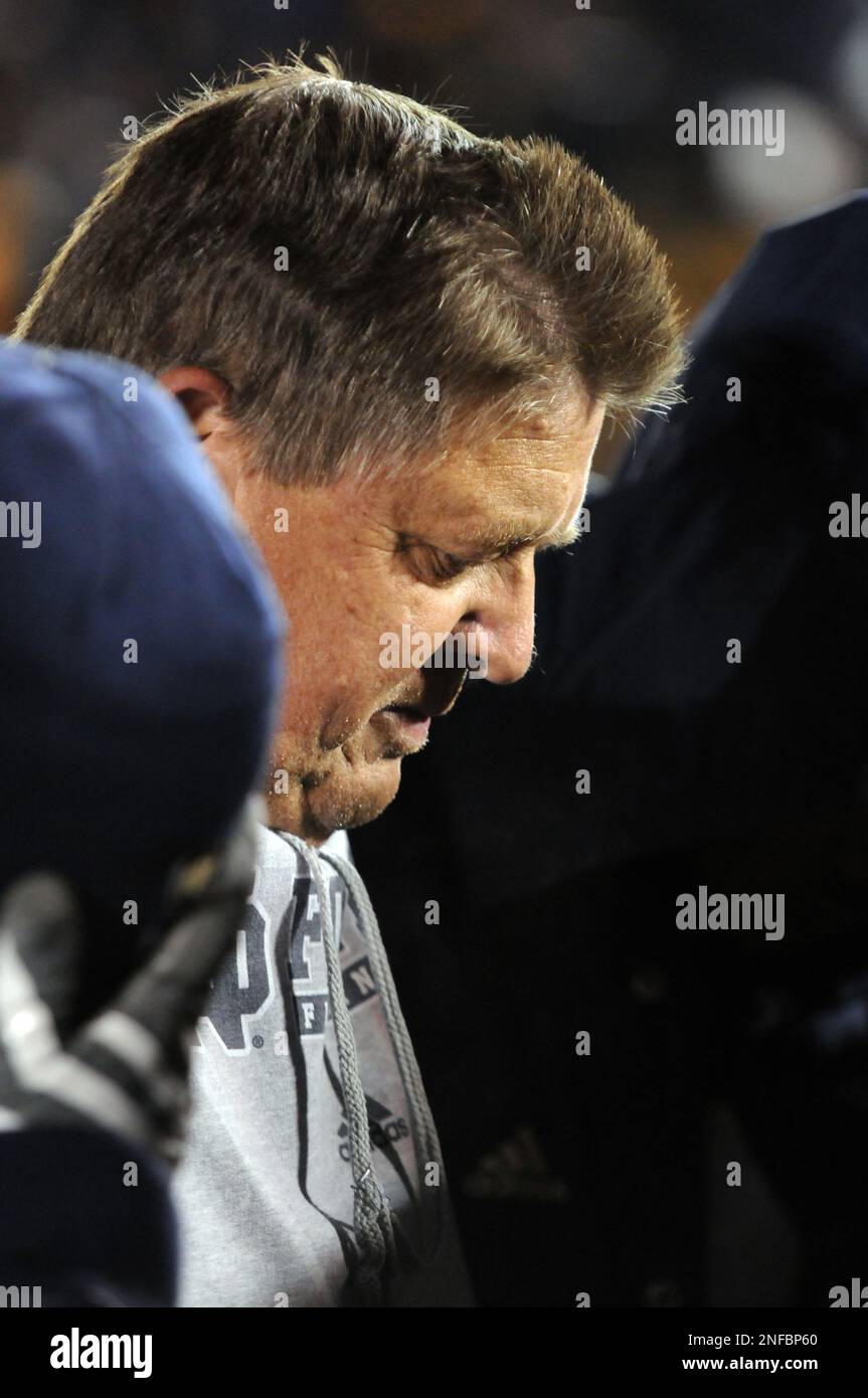 Notre Dame coach Charlie Weis looks down after their 24-23 loss to ...