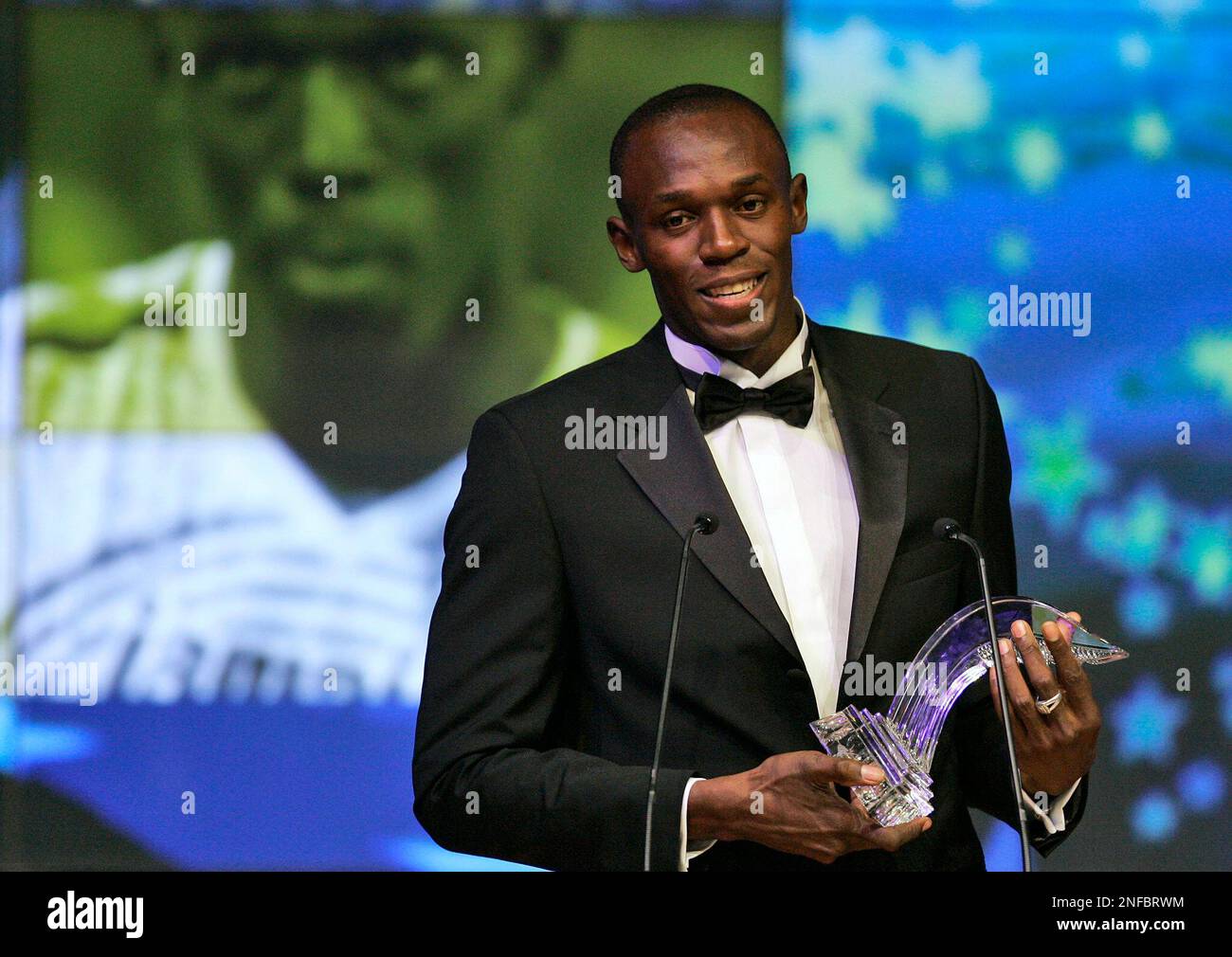 Jamaican sprinter Usain Bolt poses for photographers with his "Athlete ...