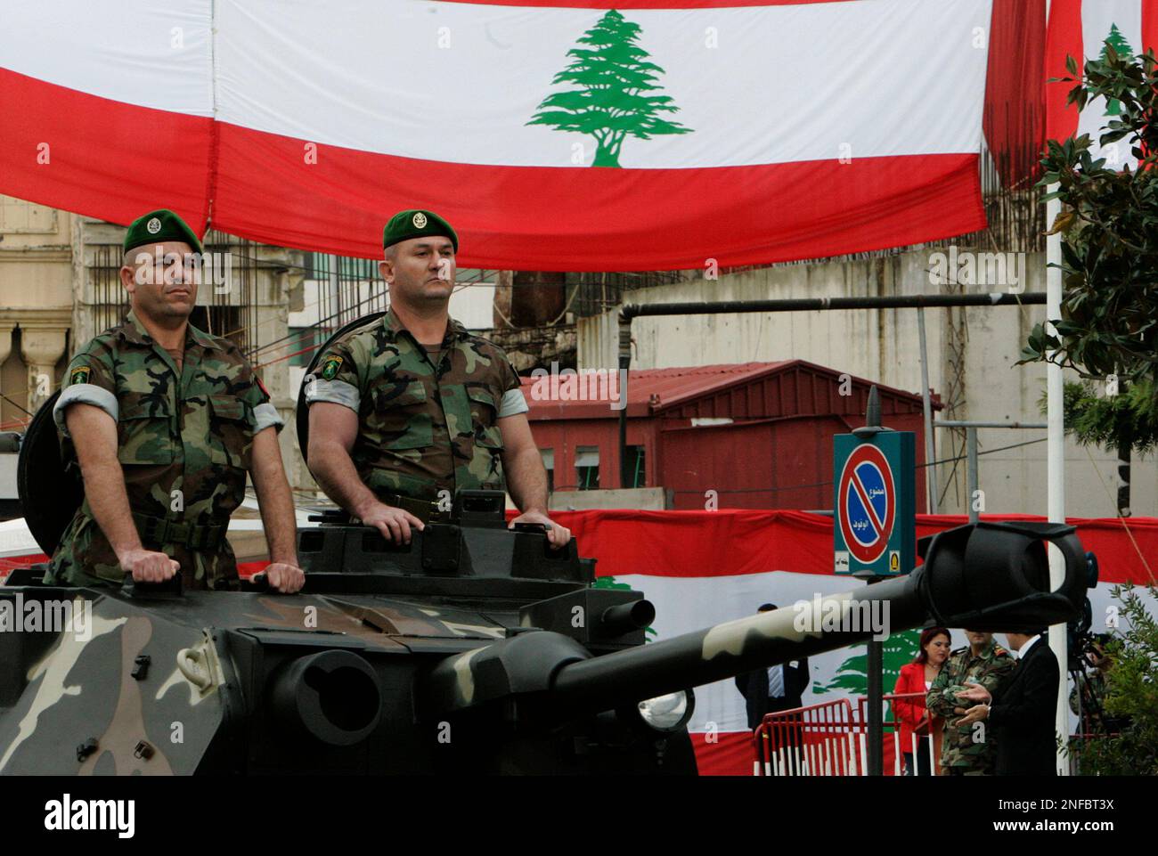 Two Lebanese soldiers, stand on their tank during a military parade to ...