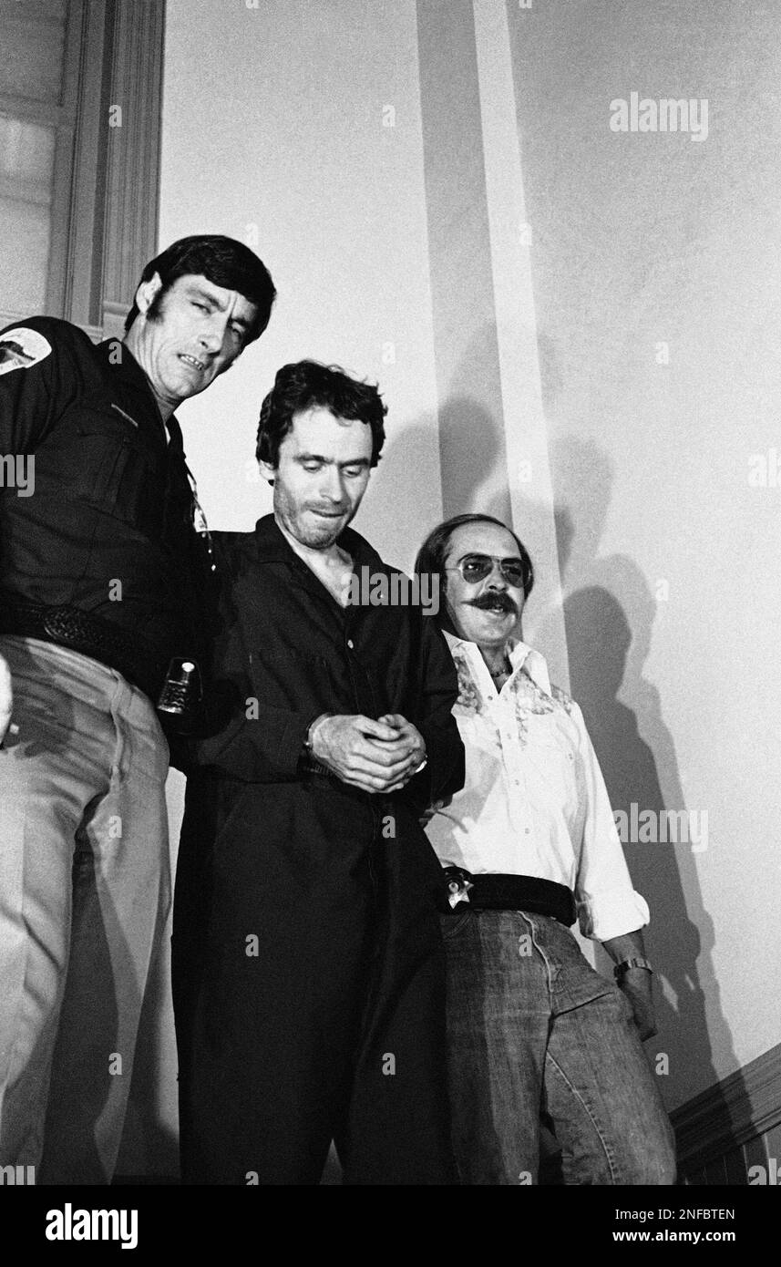 Theodore Bundy, center, leaves the courthouse in Tallahassee, Fla ...