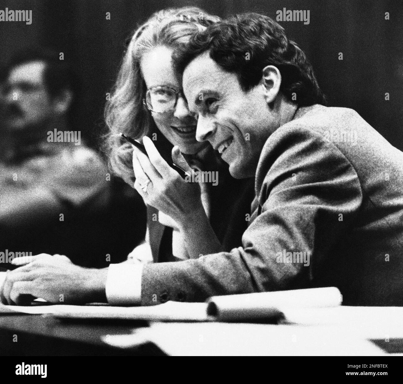 Theodore Bundy, right, smiles as he huddles with Margaret Good, a ...