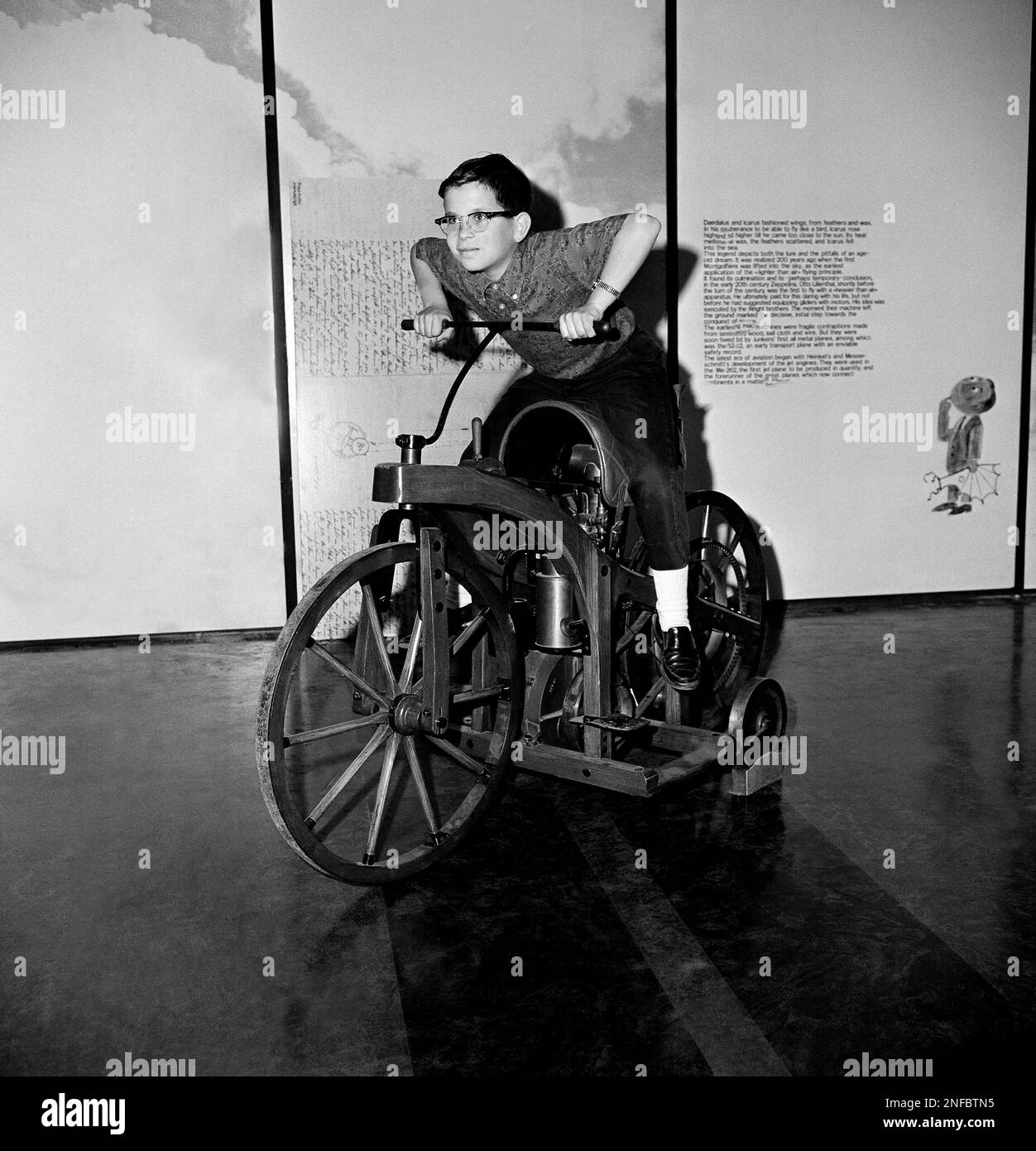 A copy of an 1885 German motorcycle interests 11-year-old Michael ...