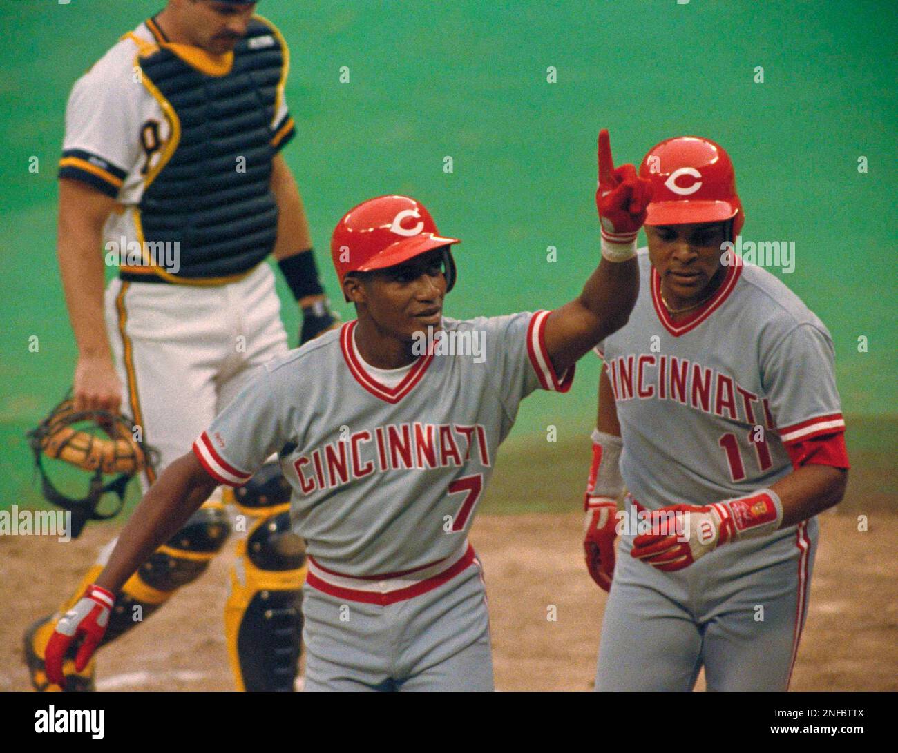 Cincinnati Reds batter Mariano Duncan gives the number one sign as he ...