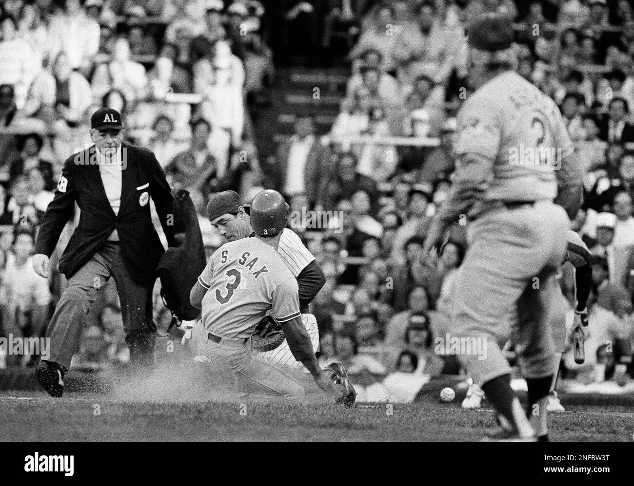 L.A. Dodgers Steve Sax (3) stirs up the dirt as he slides safely ...