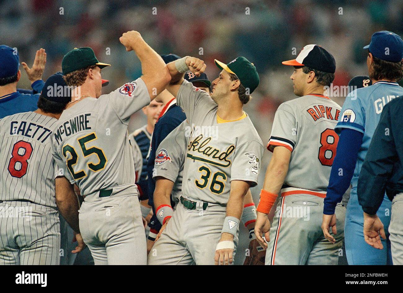 Oakland's Mark McGwire (left) bumps elbows with teammate and All Star ...