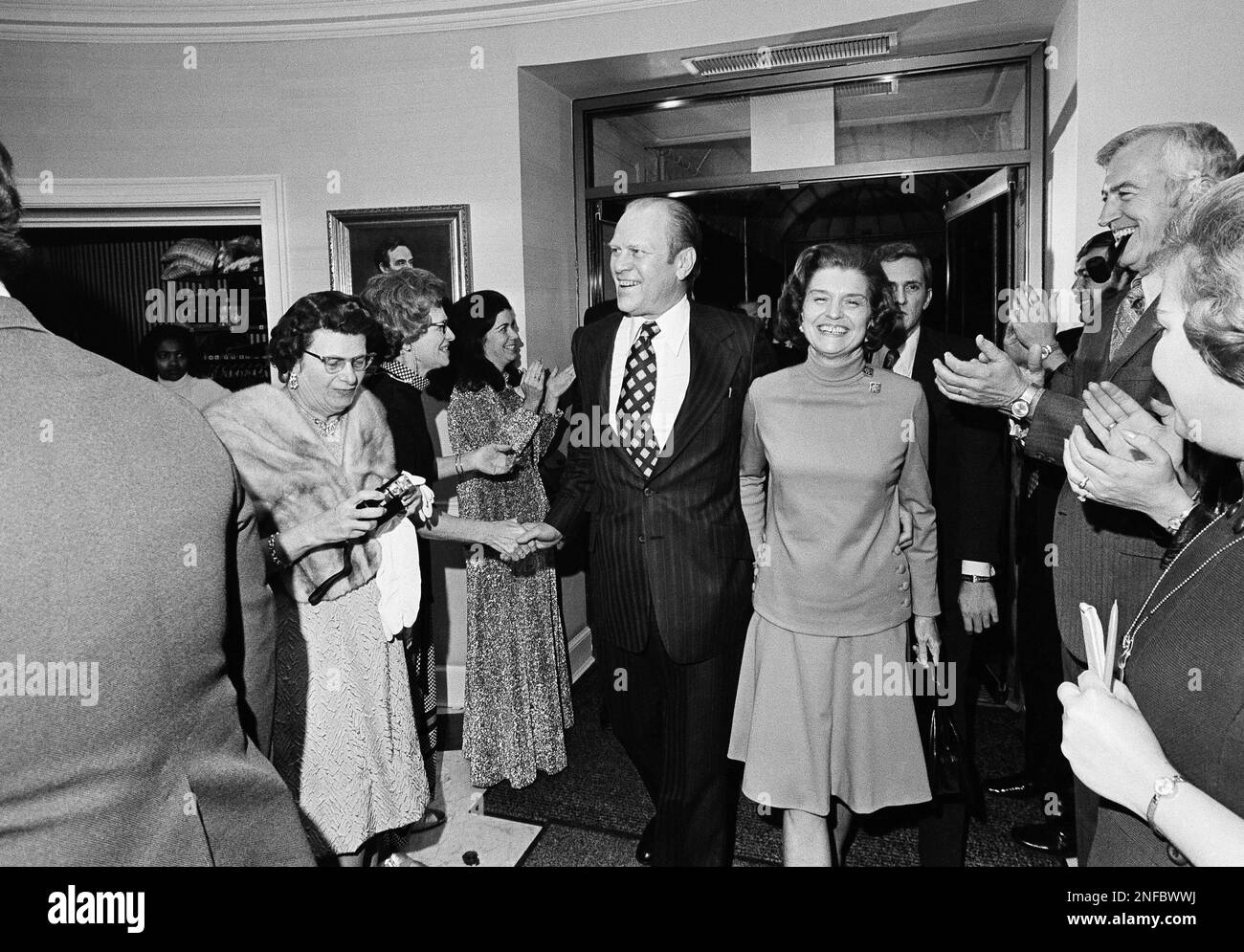 Vice President Gerald R. Ford and his wife, Betty, walk between two ...