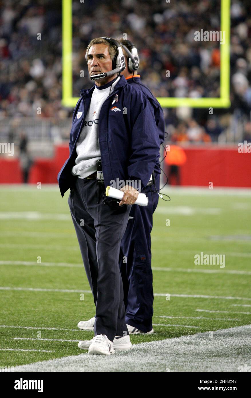 Denver Broncos coach Mike Shanahan stands on the sideline in an NFL ...