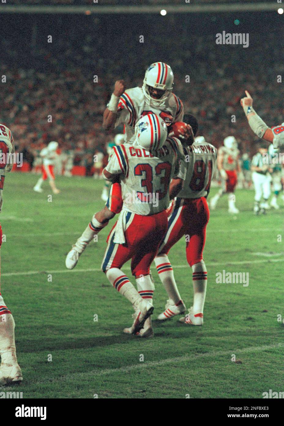 New England Patriot Stanley Morgan (86) raises his first as he ...