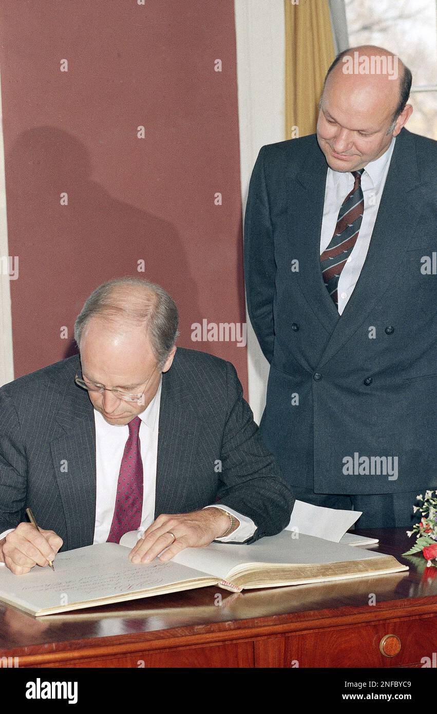 Secretary of Defense Dick Cheney signs the golden book in West Berlin ...