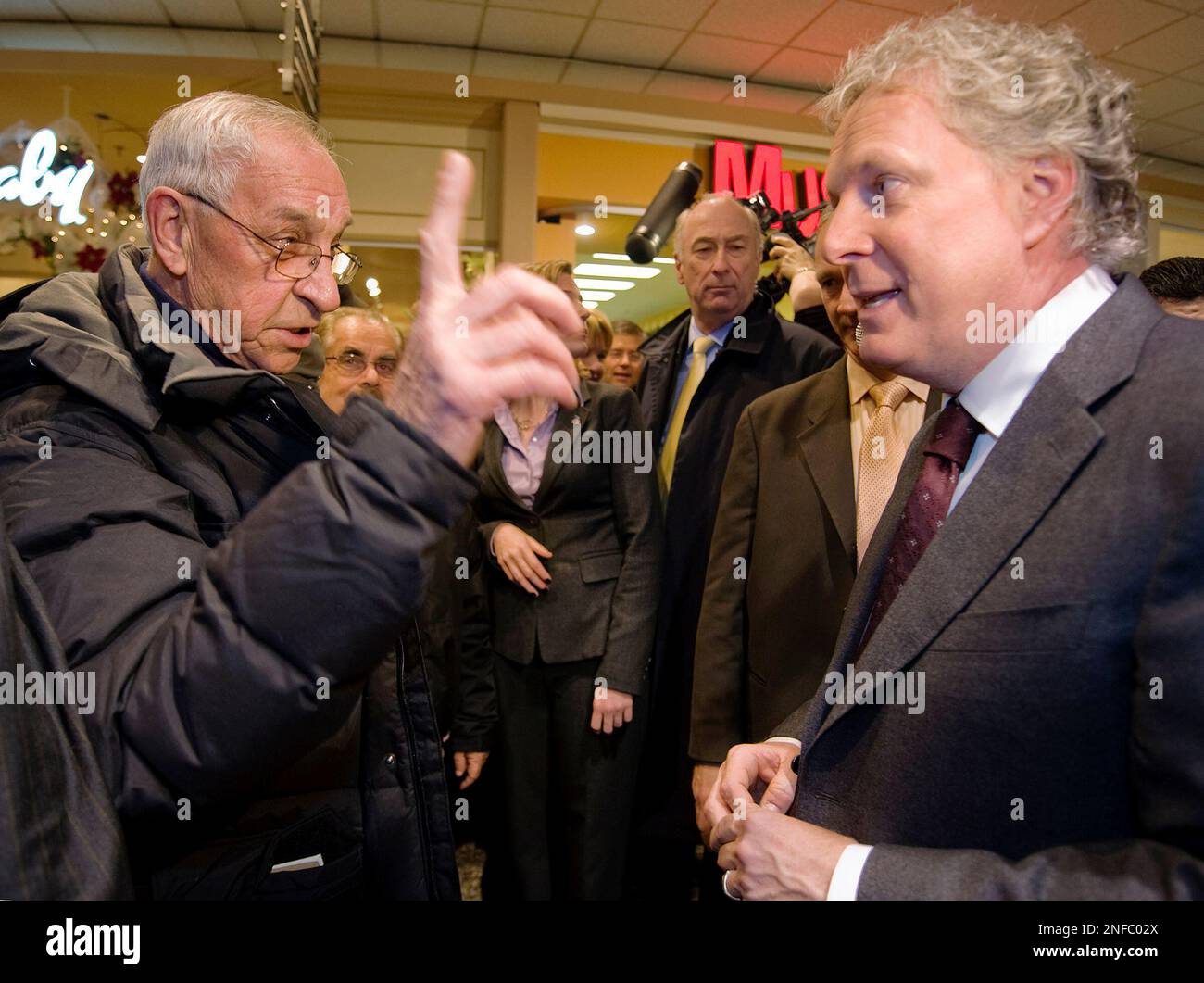 Quebec Premier Jean Charest, right, has a heated discussion with Gerard ...