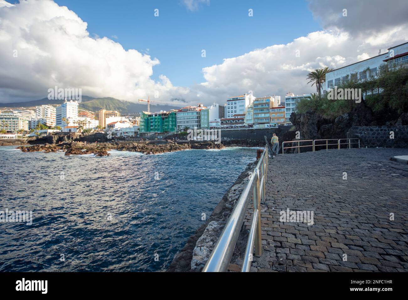 Warm sunshine palliative view from Puerto de la Cruz harbour across the ...