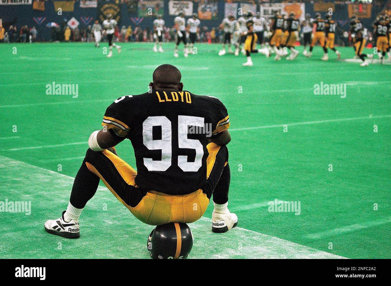 Pittsburgh Steelers Greg Lloyd sits on his helmet during the final ...