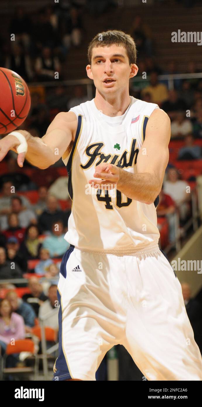 Notre Dame forward Luke Zeller passes the ball during their victory ...