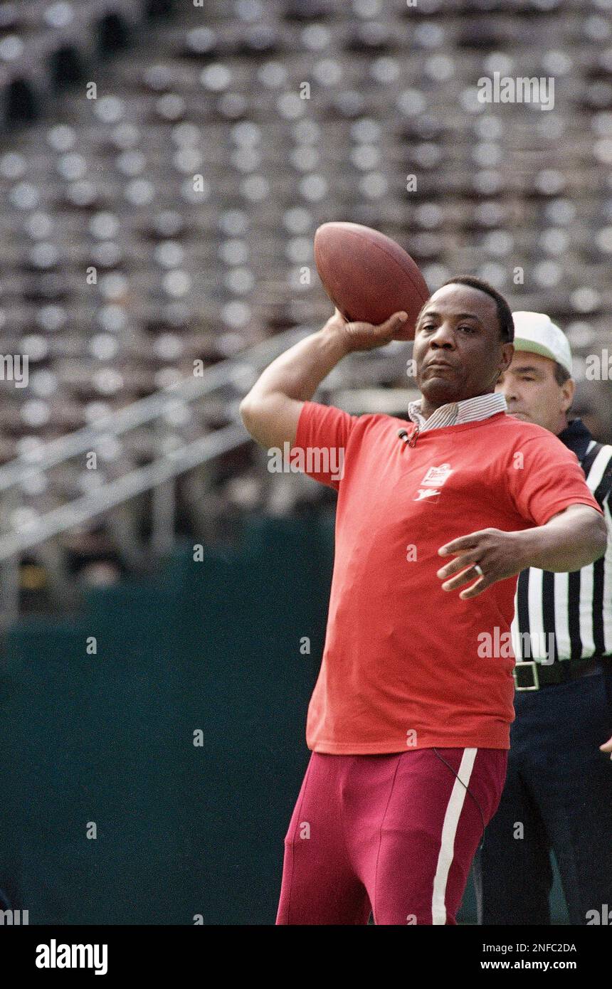 Philadelphia Mayor W. Wilson Goode pumps before throwing to a teammate ...