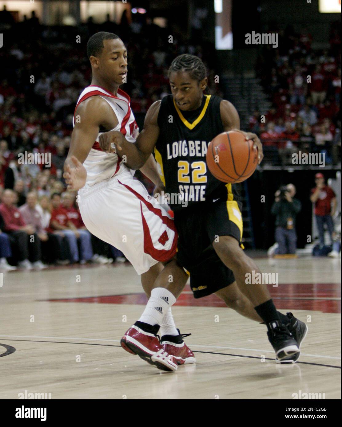 Long Beach State's Casper Ware (22) and Wisconsin's Trevon Hughes ...