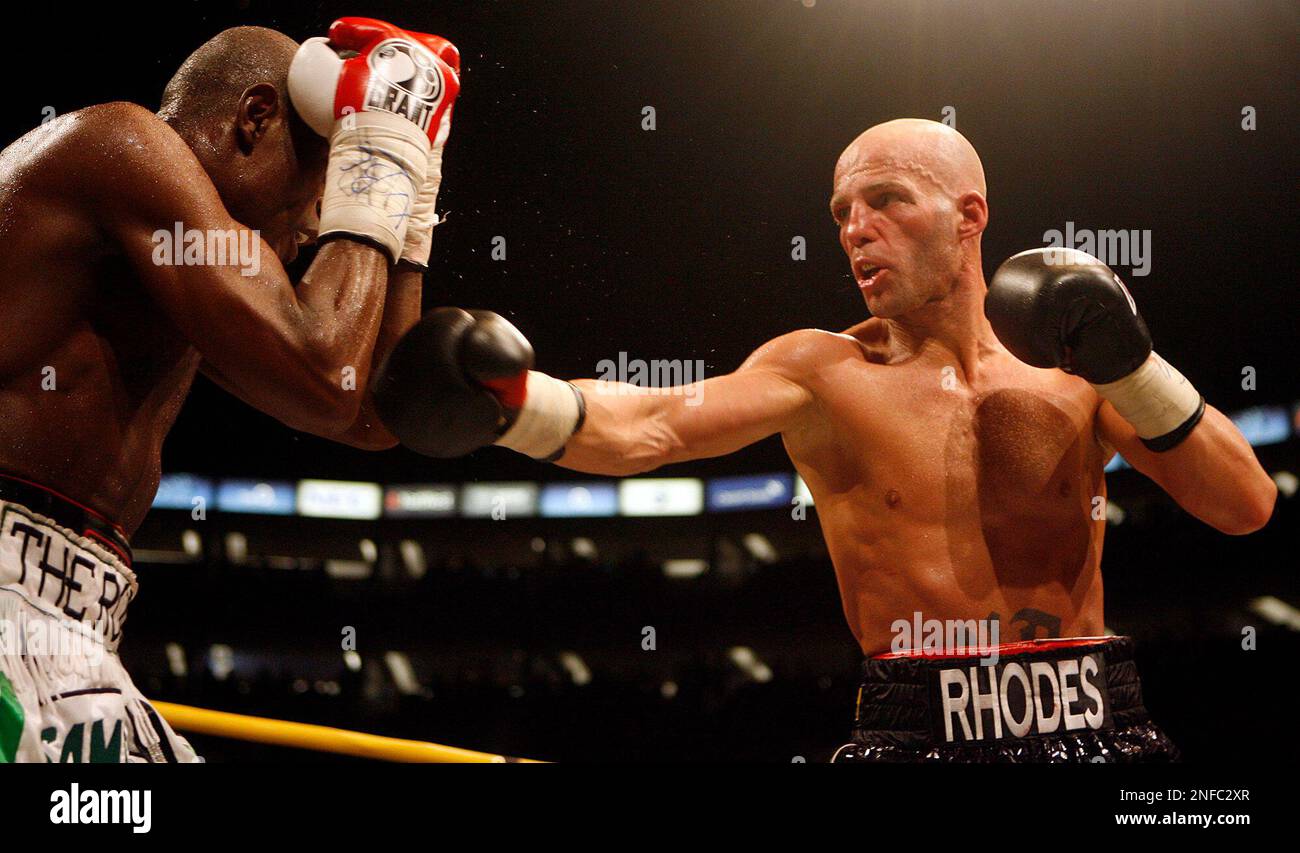 British middleweight Ryan Rhodes, right, punches South African Vincent ...