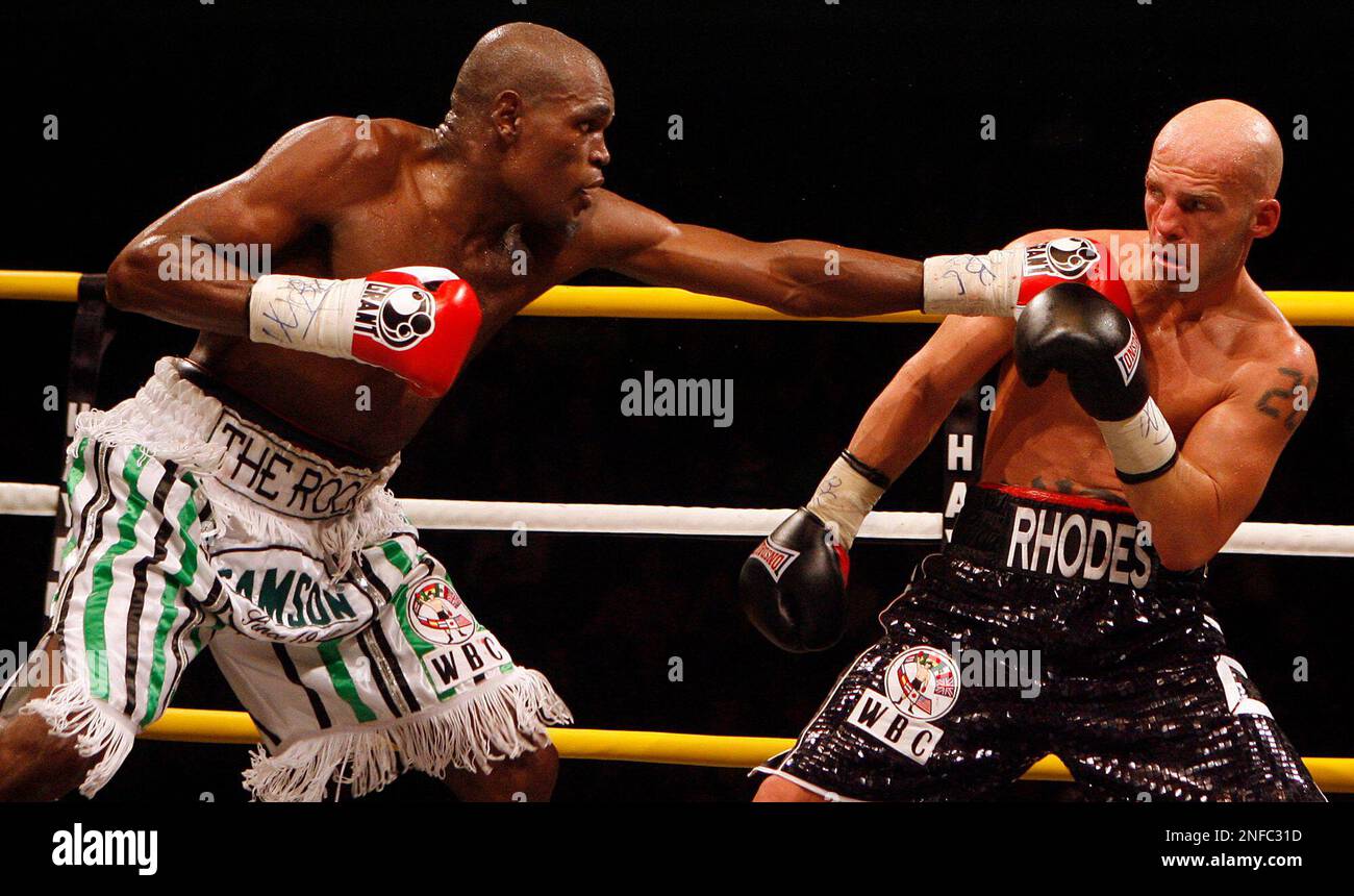 British middleweight Ryan Rhodes, right, is hit by a punch from South ...