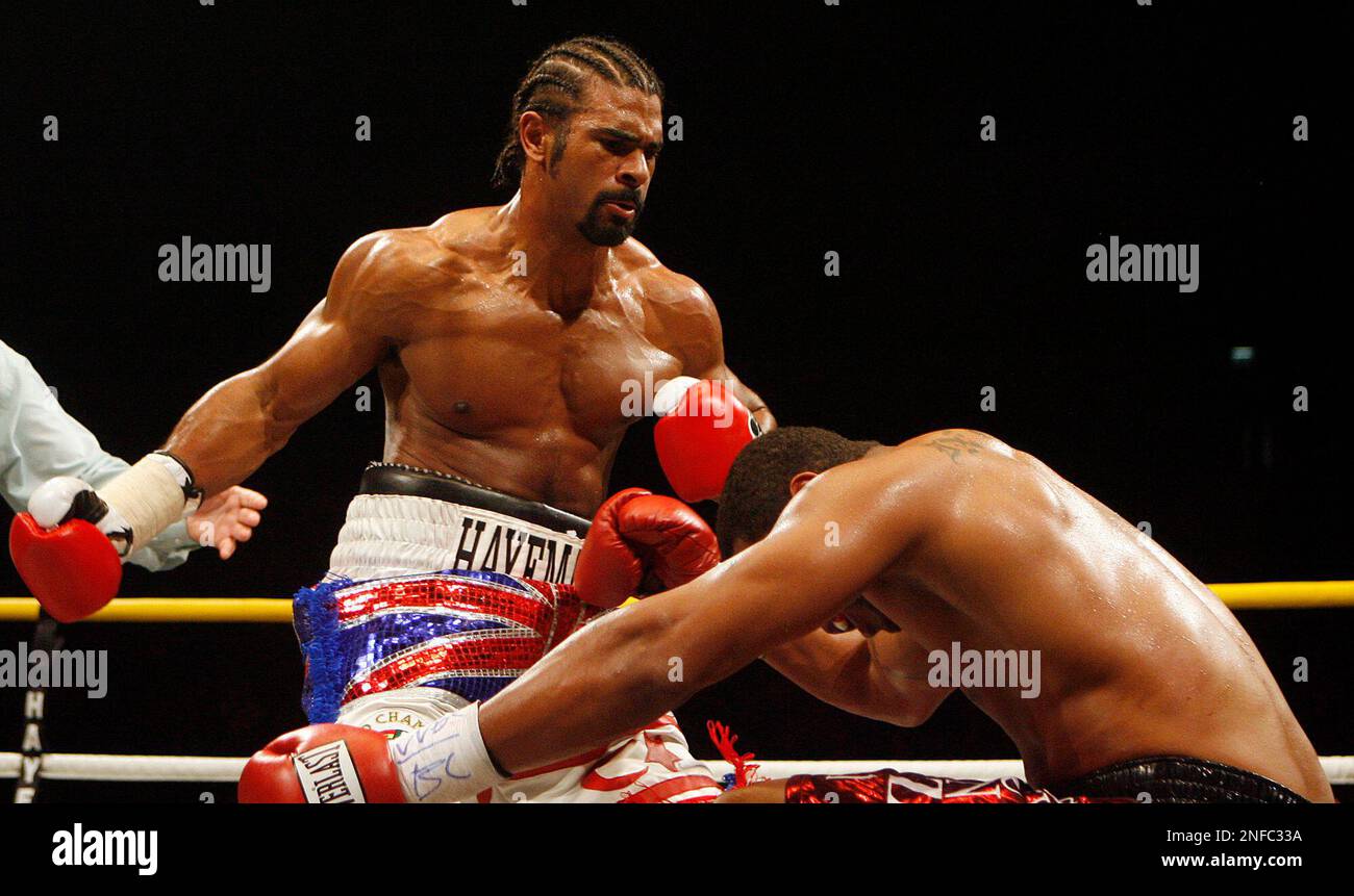 British heavyweight boxer David Haye, left, punches American Monte ...