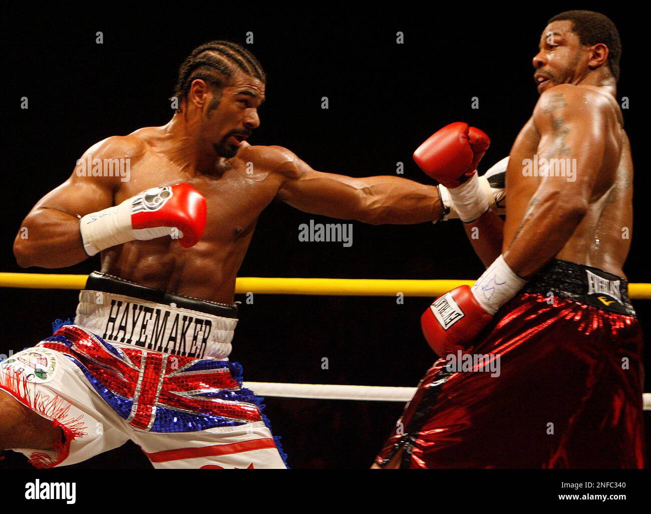 British heavyweight boxer David Haye, left, punches American Monte ...