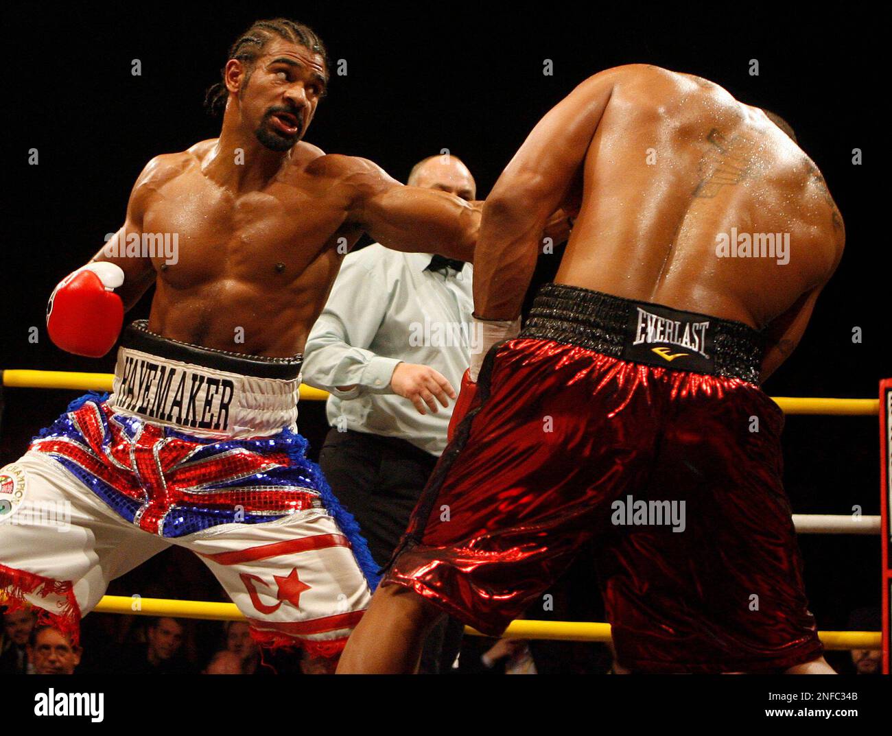 British heavyweight boxer David Haye, left, punches American Monte ...