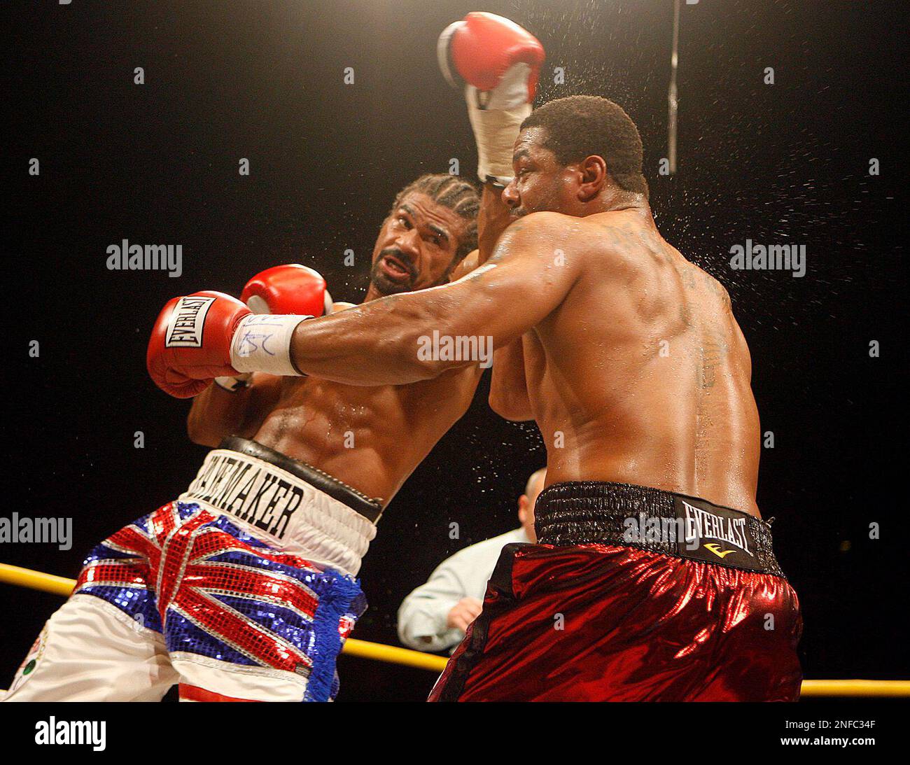 British heavyweight boxer David Haye, left, punches American Monte ...