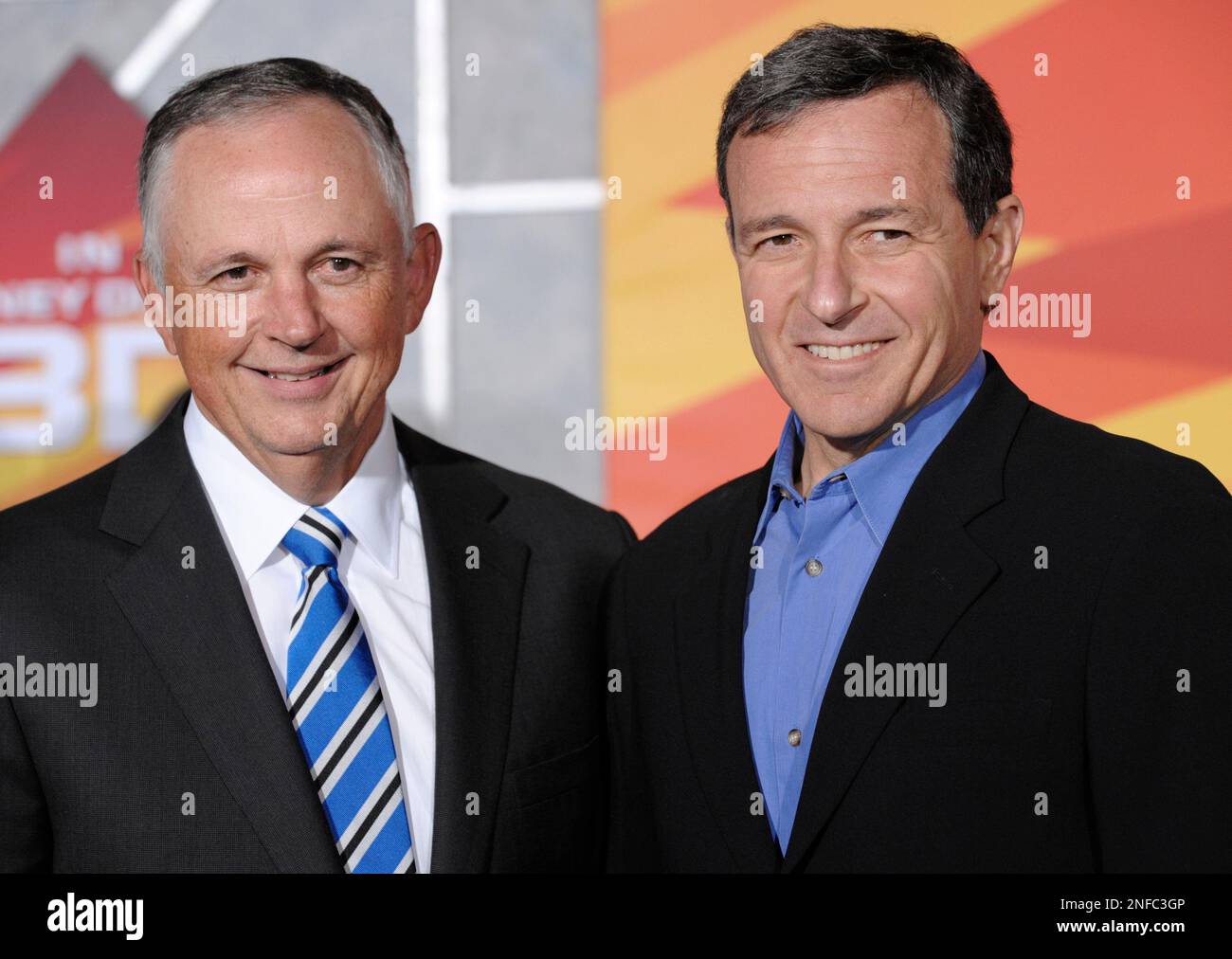Dick Cook, left, chairman of Walt Disney Studios, and Robert Iger ...