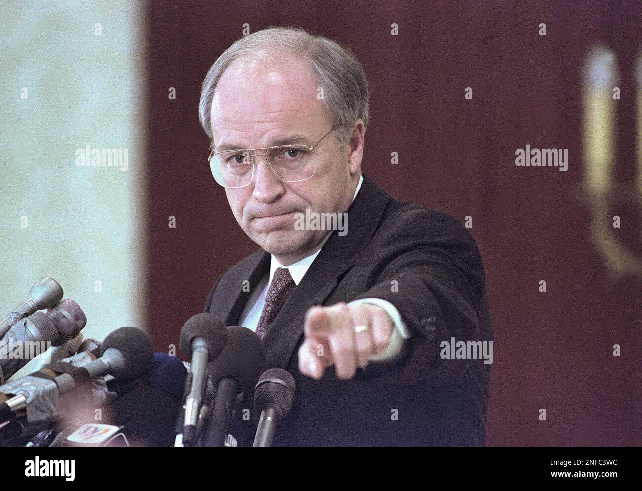 U.S. Defense Secretary Dick Cheney points to a reporter for a question ...