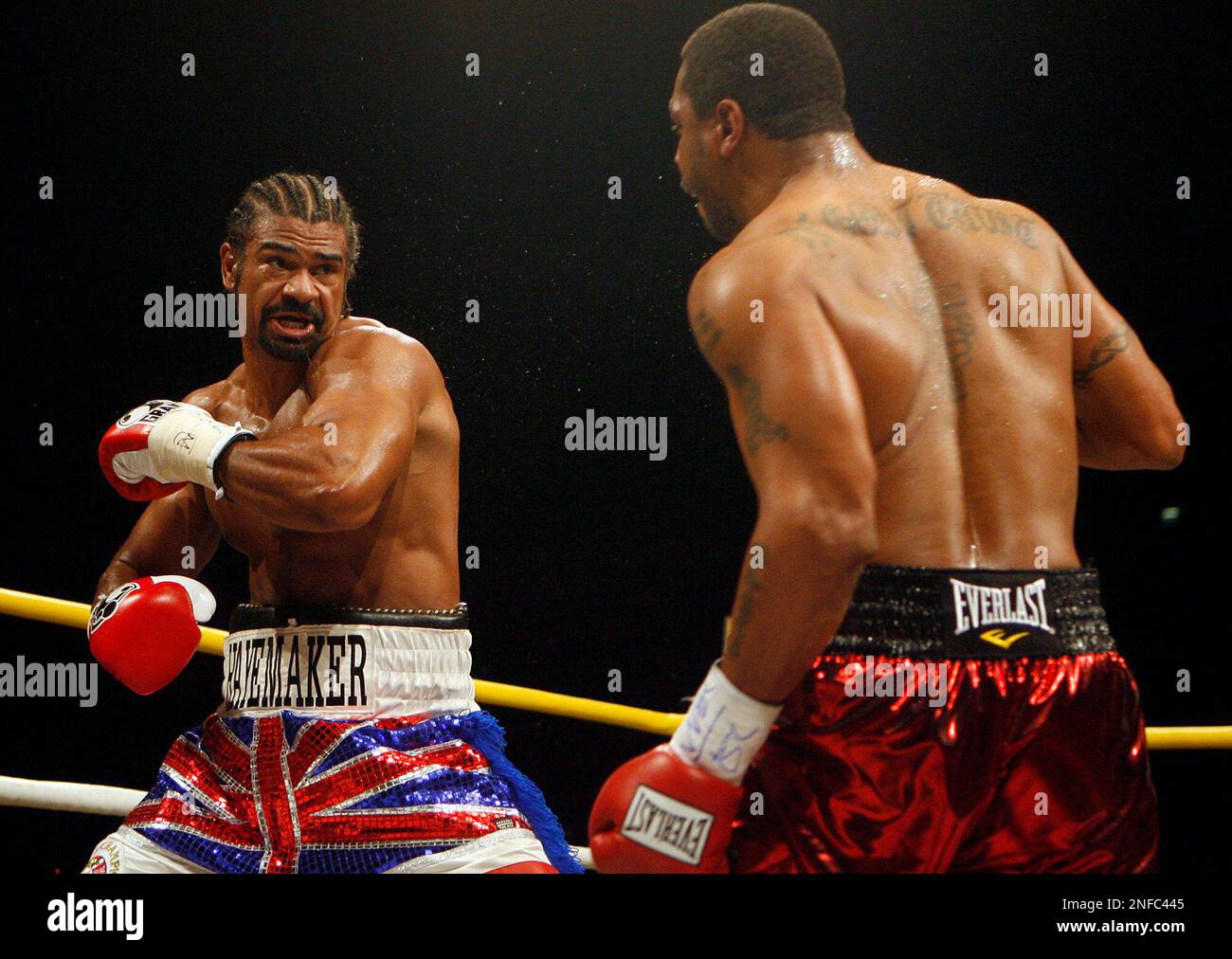 British heavyweight boxer David Haye, left, punches American Monte ...