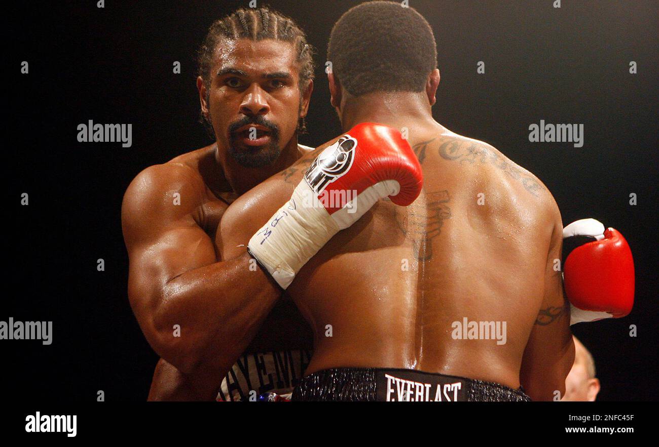 British heavyweight boxer David Haye, left, holds onto American Monte ...