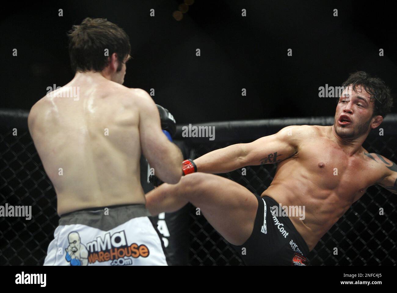 Jorge Gurgel, right, exchanges blows with Aaron Riley during their UFC ...