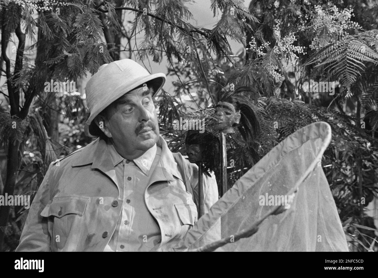 Clad in regulation Khaki fatigues and pith helmet British actor Robert ...