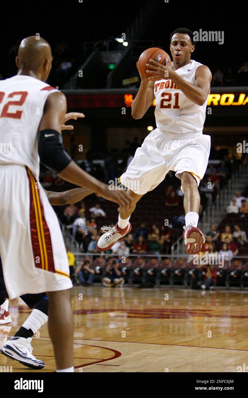 Southern California's Dwight Lewis (21) is airborne as he passes the ...