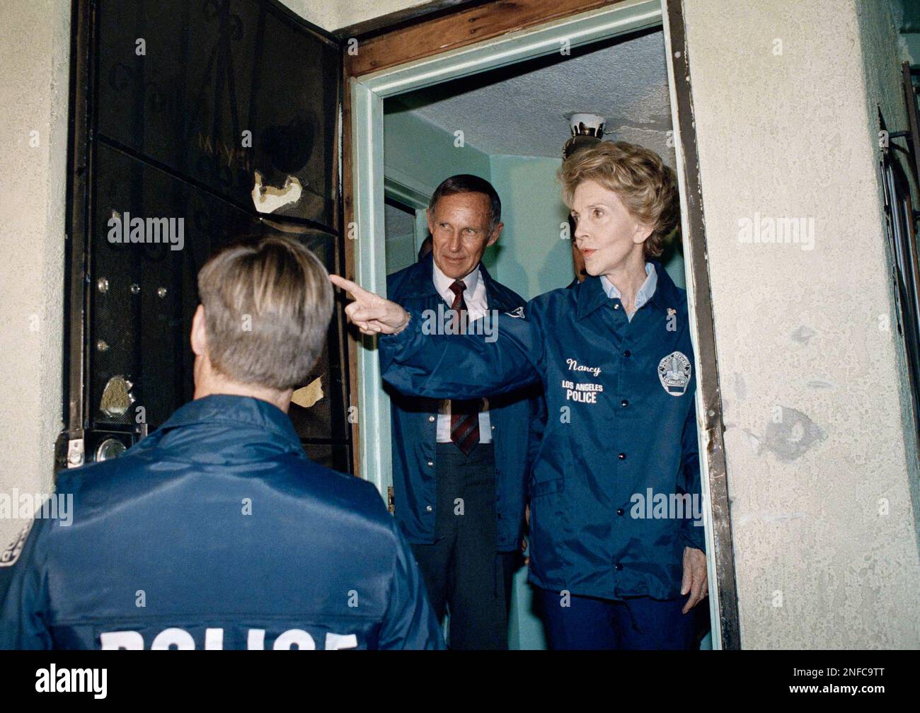 Nancy Reagan counts the bullets holes in the re-enforced front door ...