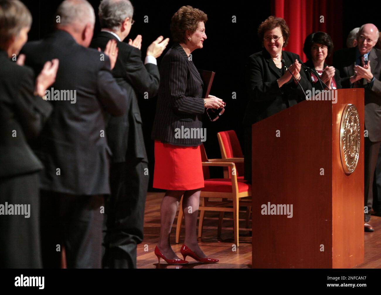 New York State Chief Judge Judith Kaye, center, is applauded by ...