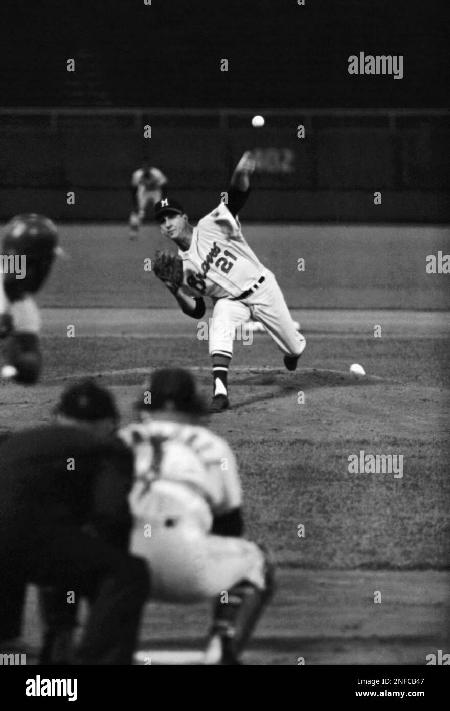 Milwaukee Braves pitcher Warren Spahn shows his form during the game ...