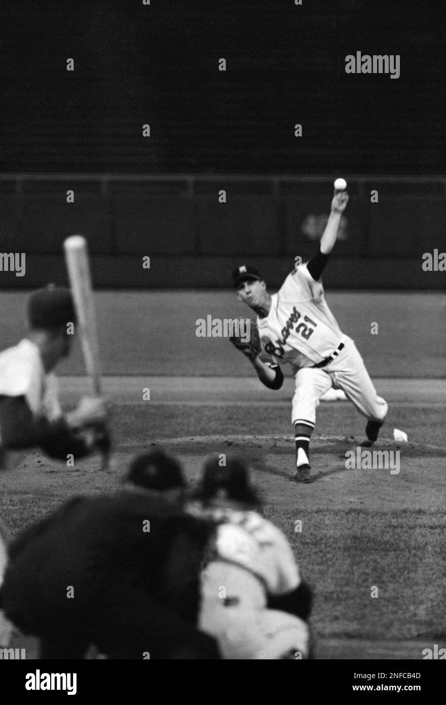 Milwaukee Braves pitcher Warren Spahn shows his form during the game ...