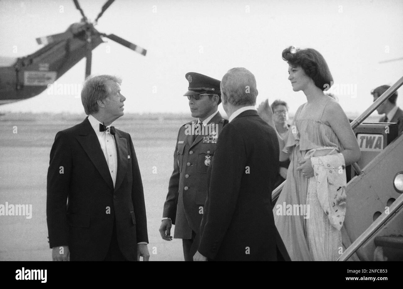 President Jimmy Carter, left, sports a dinner jacket as he waits at New ...