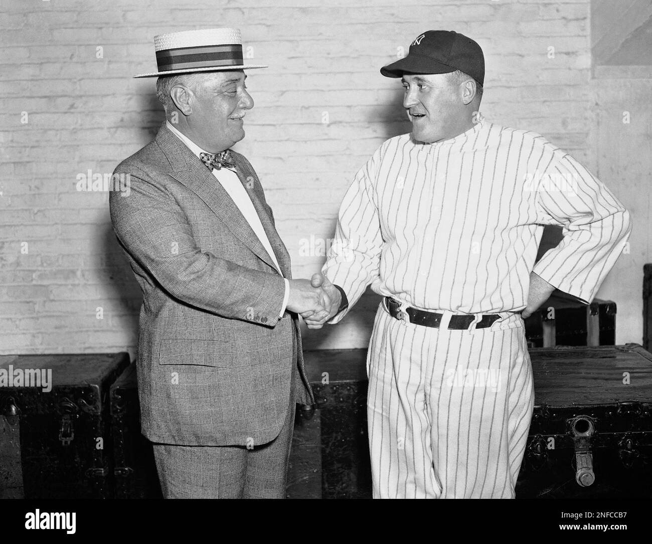 Col. Jacob Ruppert, left, congratulates Joe McCarthy at Yankee Stadium ...
