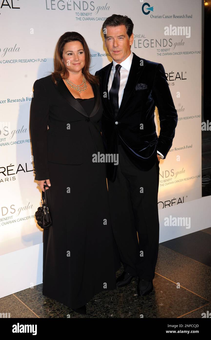 Pierce Brosnan, right, and his wife, Keely Shaye Smith, pose for photos ...