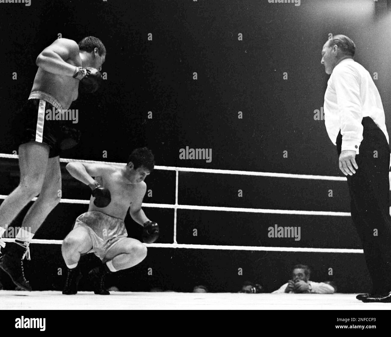 Billy Walker, left, stands over Johnny Prescott after he knocked him ...