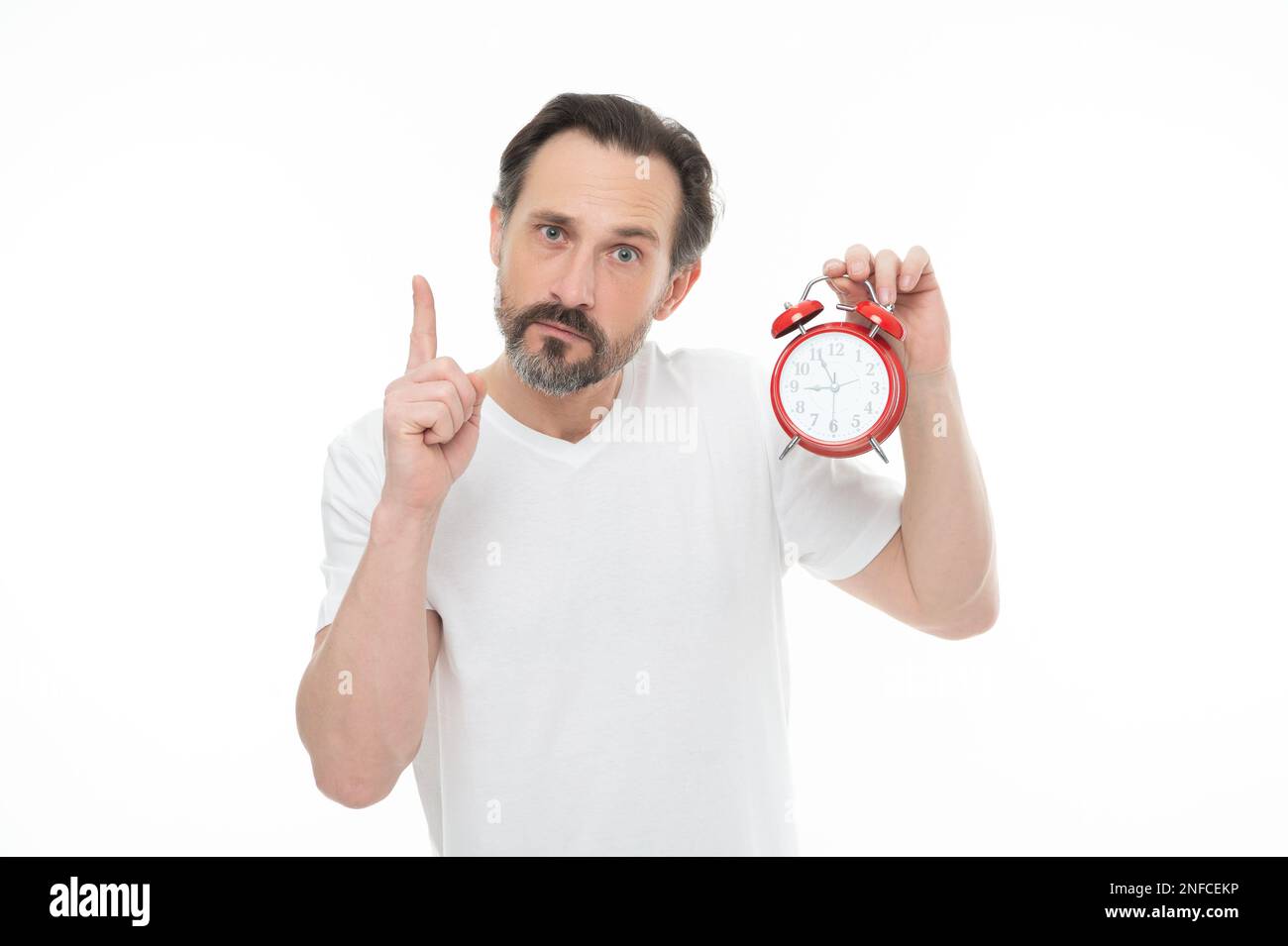 man with alarm clock isolated on white, pointing. man with alarm clock ...