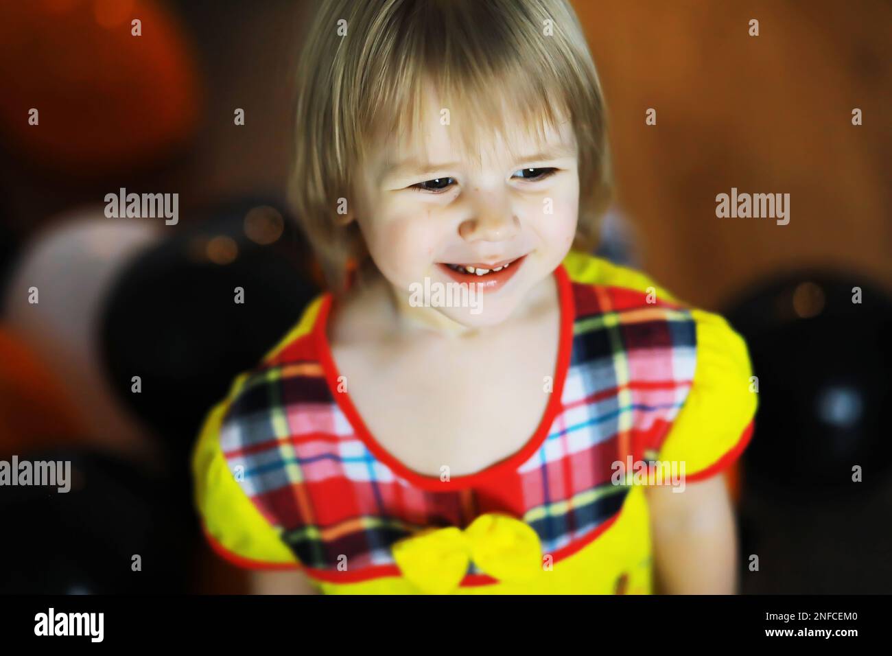 Baby's birthday in the decorated area, portrait of a happy kid, indoor ...