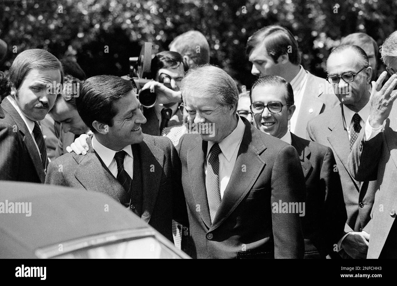 President Jimmy Carter has his arm around Spanish Premier Adolfo Suarez ...