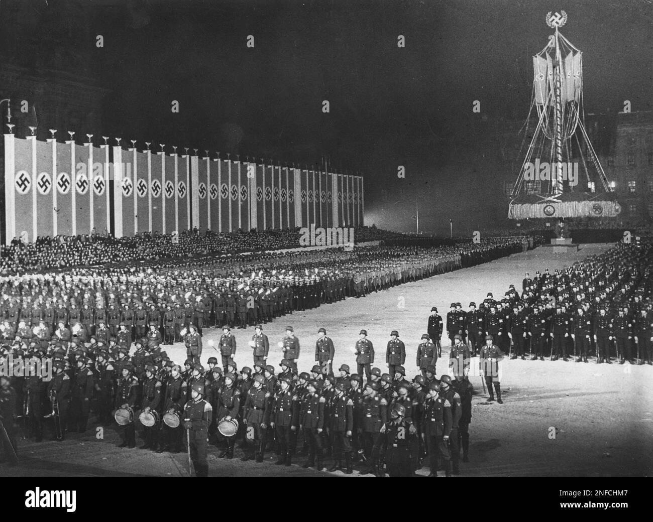 Thousands of uniformed Nazis stand in formation in Berlin, Germany ...